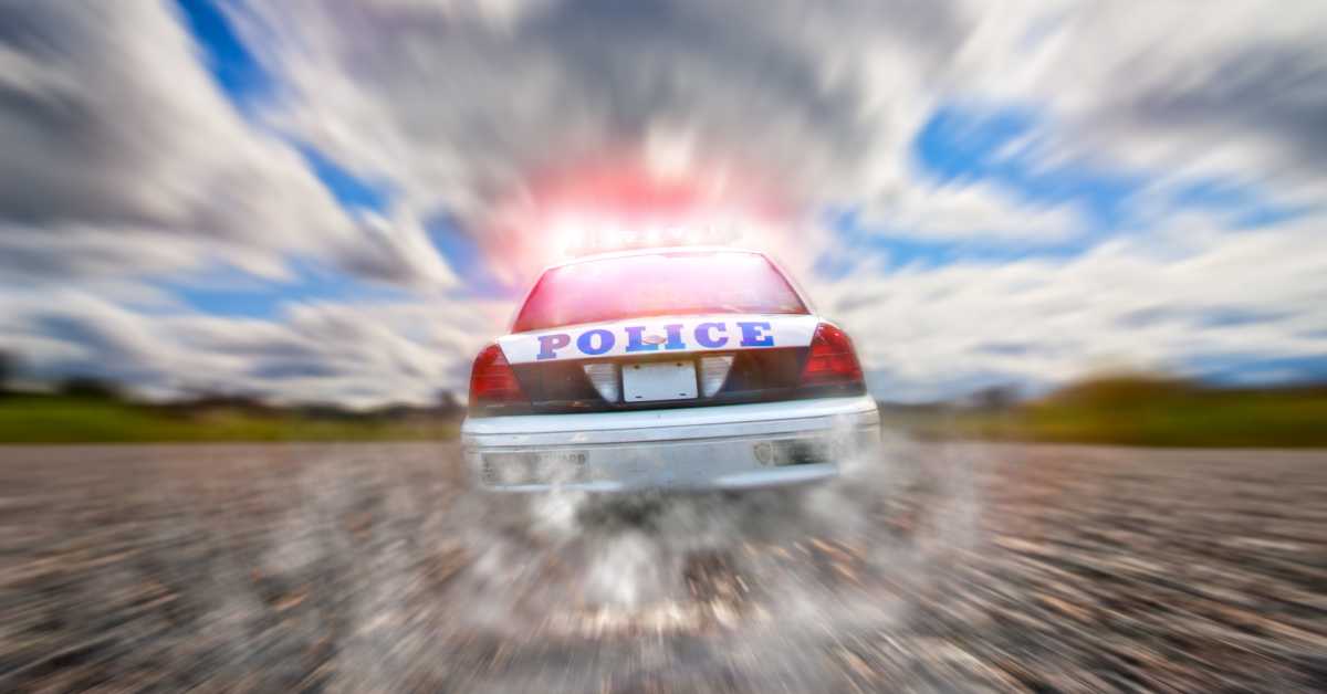 Speeding Police Car Turns Too Fast In Rain and Causes Embarrassing ...